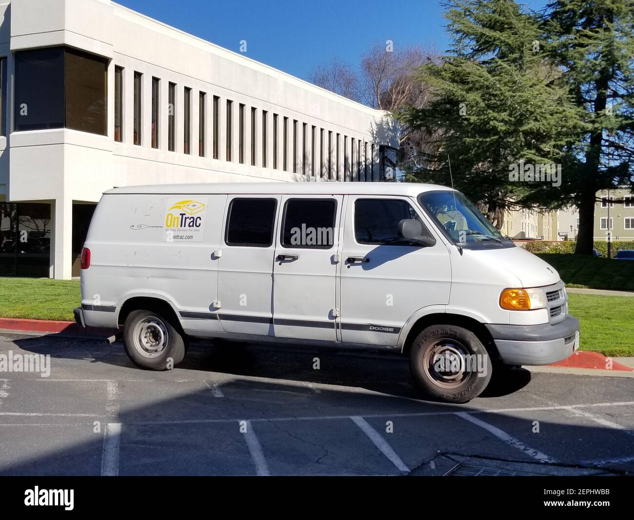Side view of delivery vehicle for last-mile delivery service On Trac, a ...
