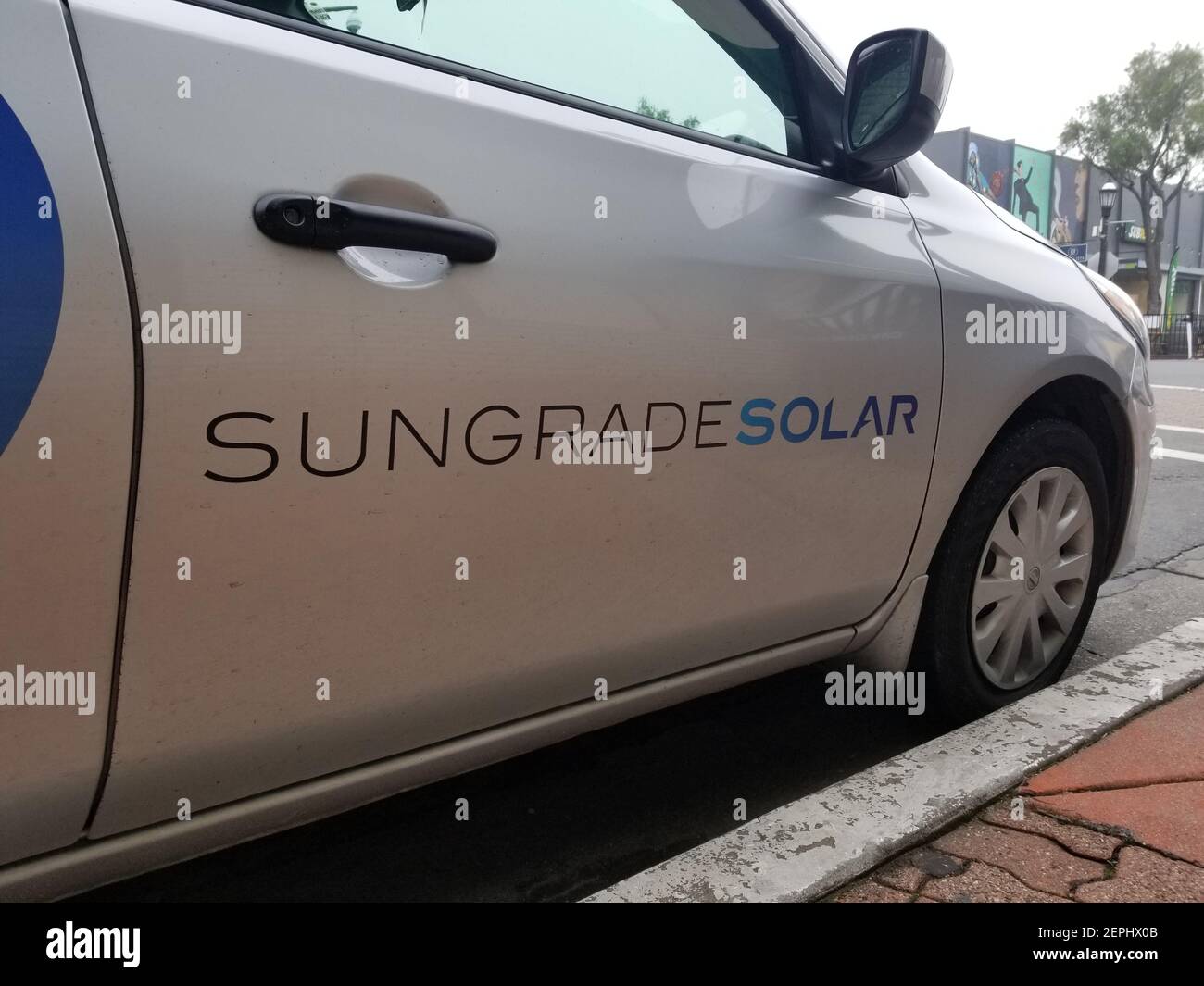 Close-up of logo for solar company Sungrade Solar on a vehicle in ...
