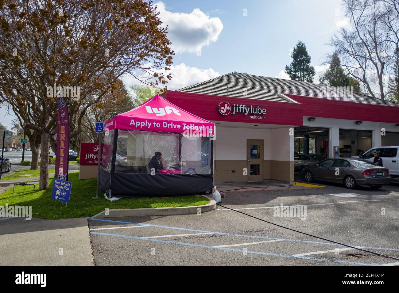Tent and building with logos for automotive company Jiffy Lube and ...