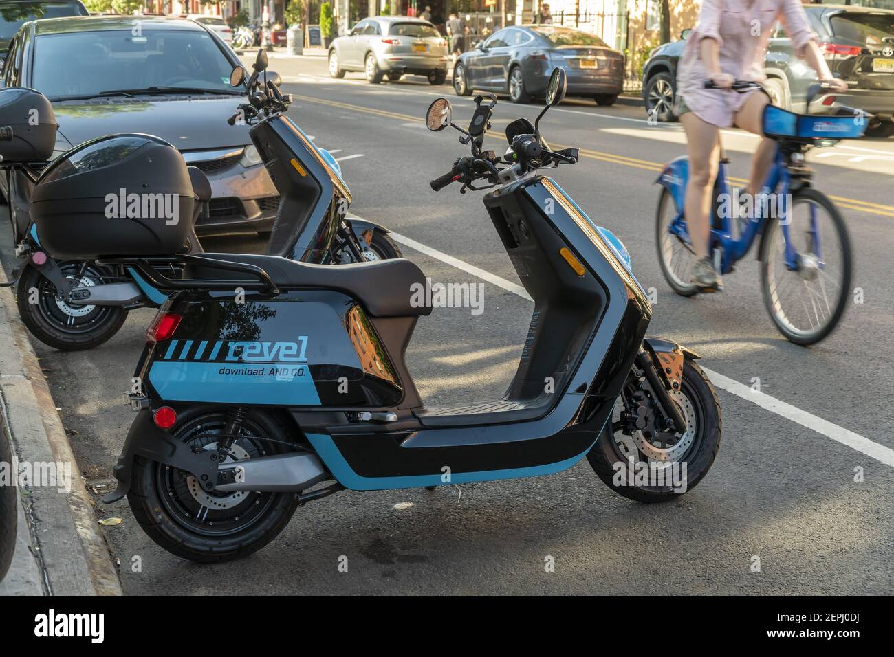 A pair of electric mopeds from the moped sharing company Revel parked ...
