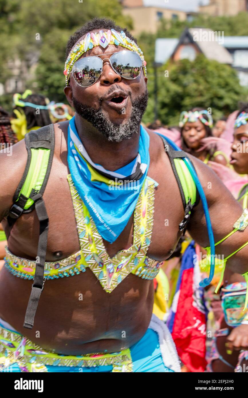 A participant parading in a colourful costume during the Toronto ...