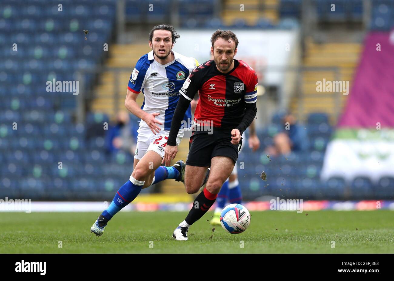 Coventry City's Liam Kelly (right) and Blackburn Rovers' Lewis Travis ...