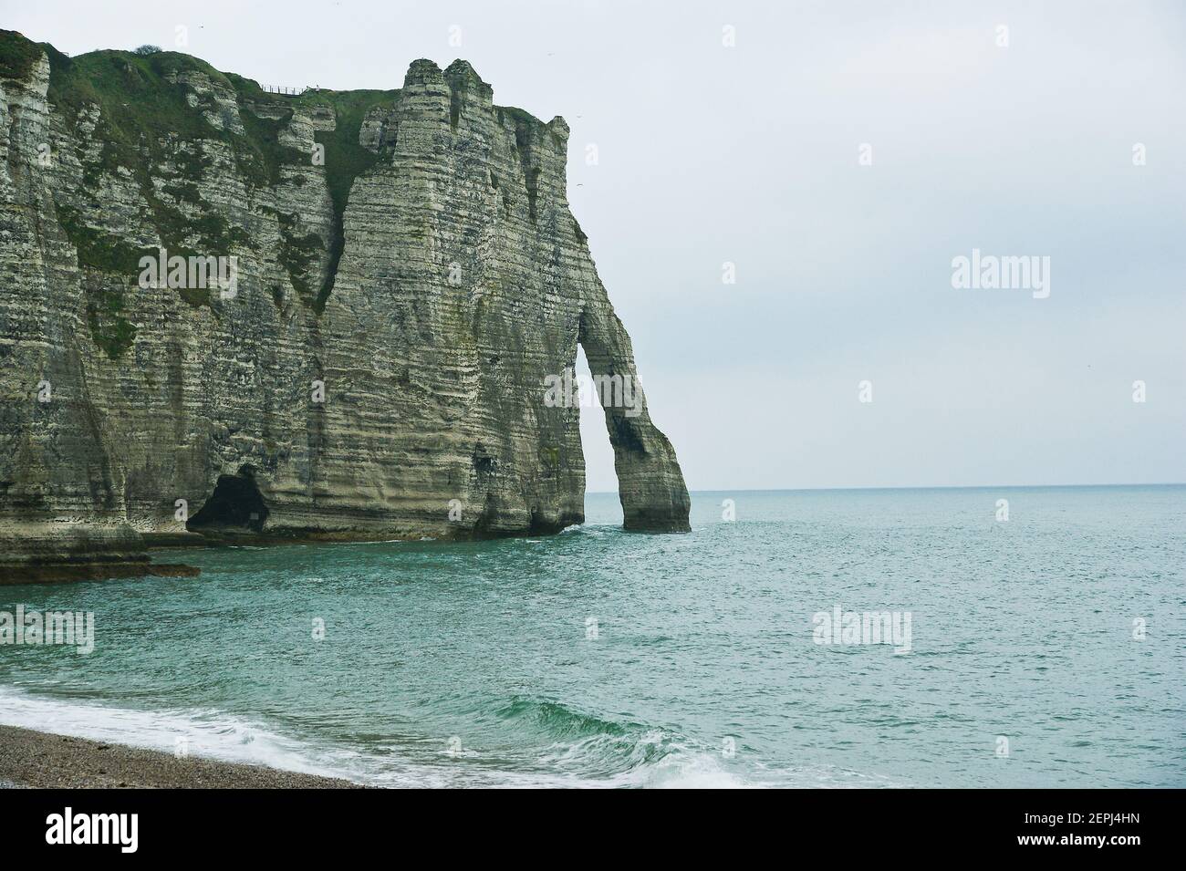 white cliffs and natural arches at Etretat in French Normandy Stock ...