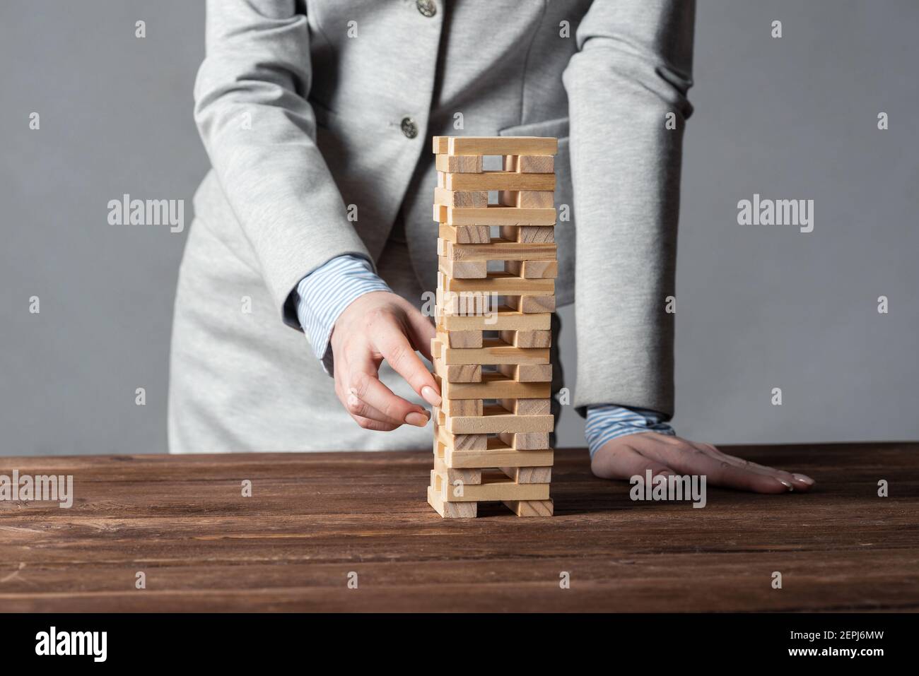 Woman removing block from hi-res stock photography and images - Alamy