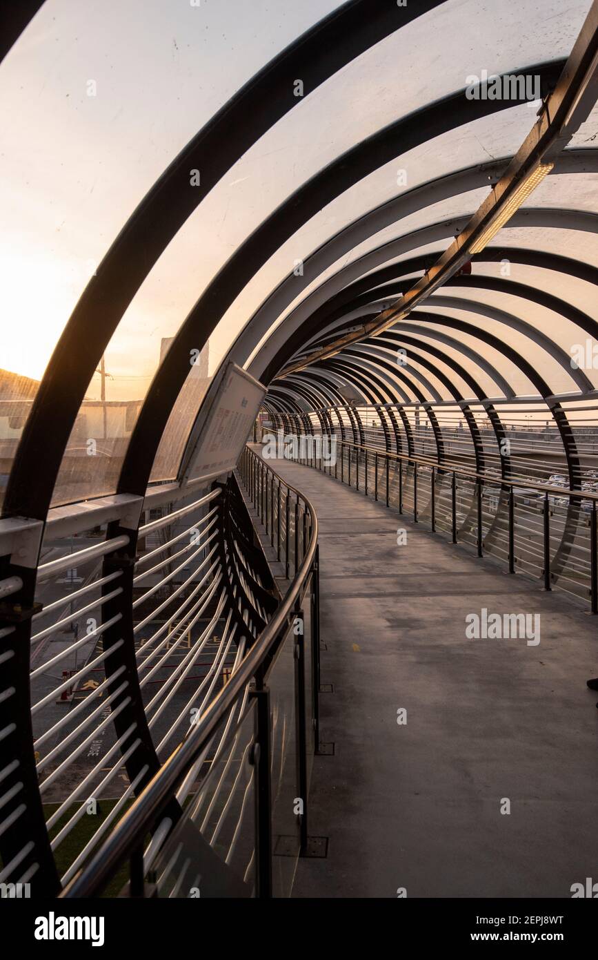 Morning light on the Sir Peter Mansfield tram bridge at the Queens ...
