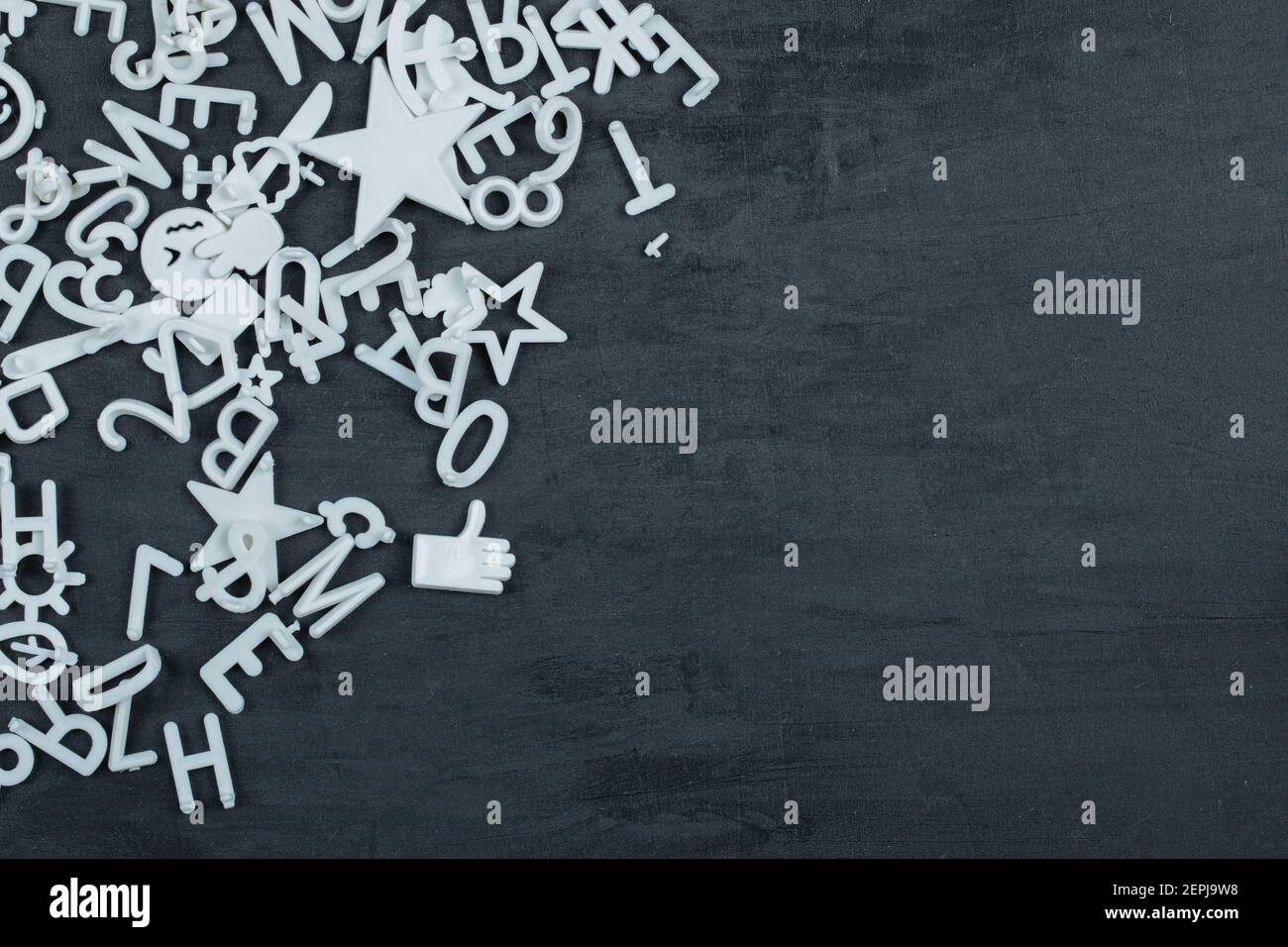 White plastic letters, icons and symbols on grey background Stock Photo ...