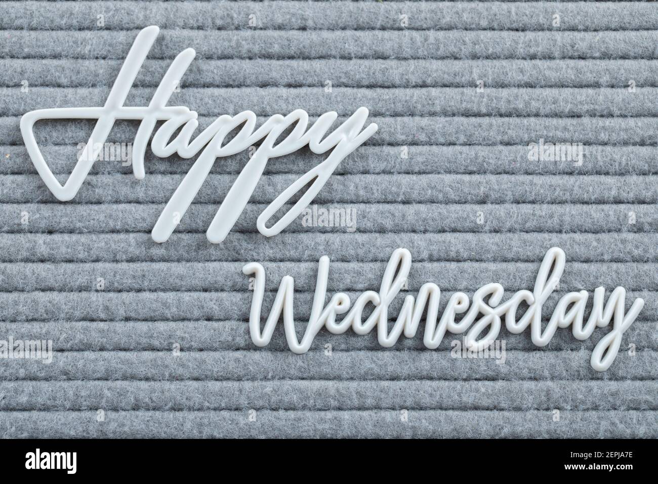 Happy weekdays poster written with letter symbols on the grey tissue ...