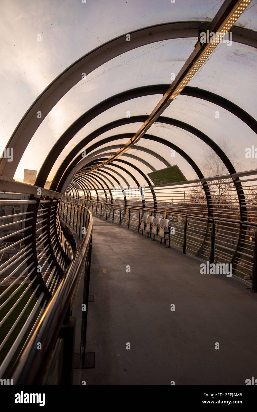 Morning light on the Sir Peter Mansfield tram bridge at the Queens ...