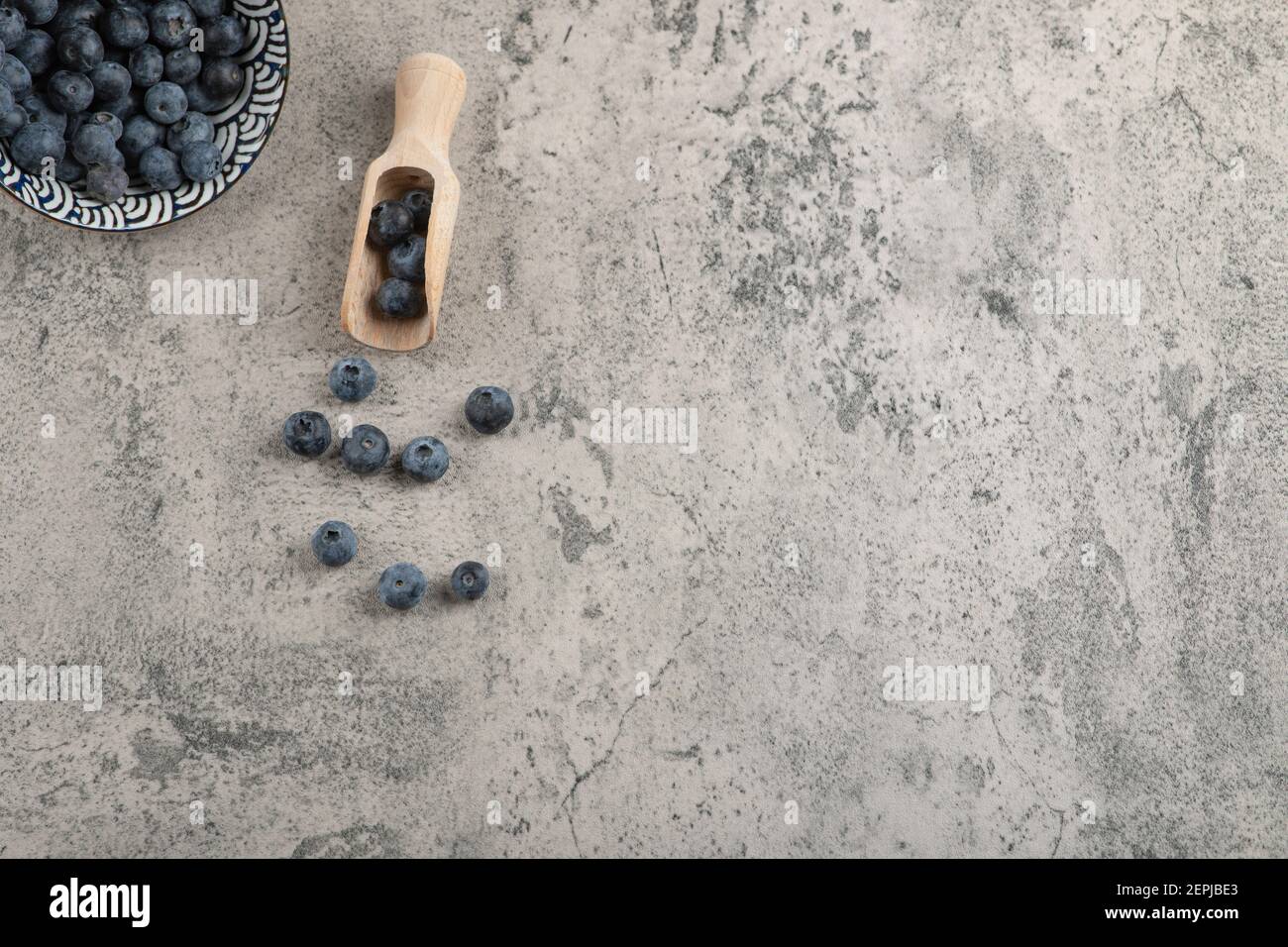 Ceramic bowl of delicious fresh blueberries on marble surface Stock ...