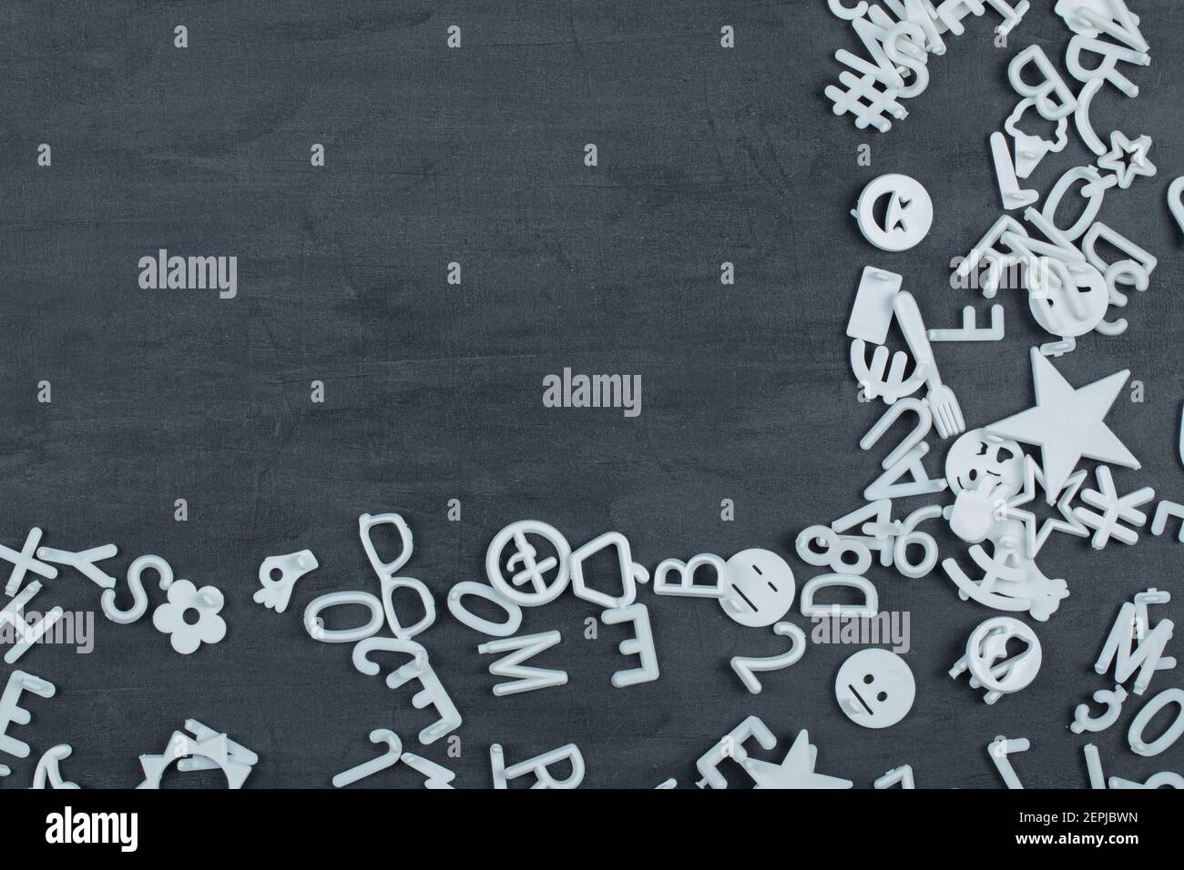 White plastic letters, icons and symbols on grey background Stock Photo ...