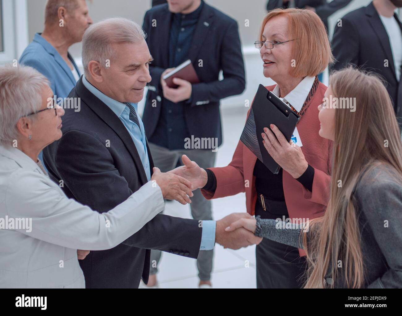 Handshakes on group of business people meeting Stock Photo - Alamy
