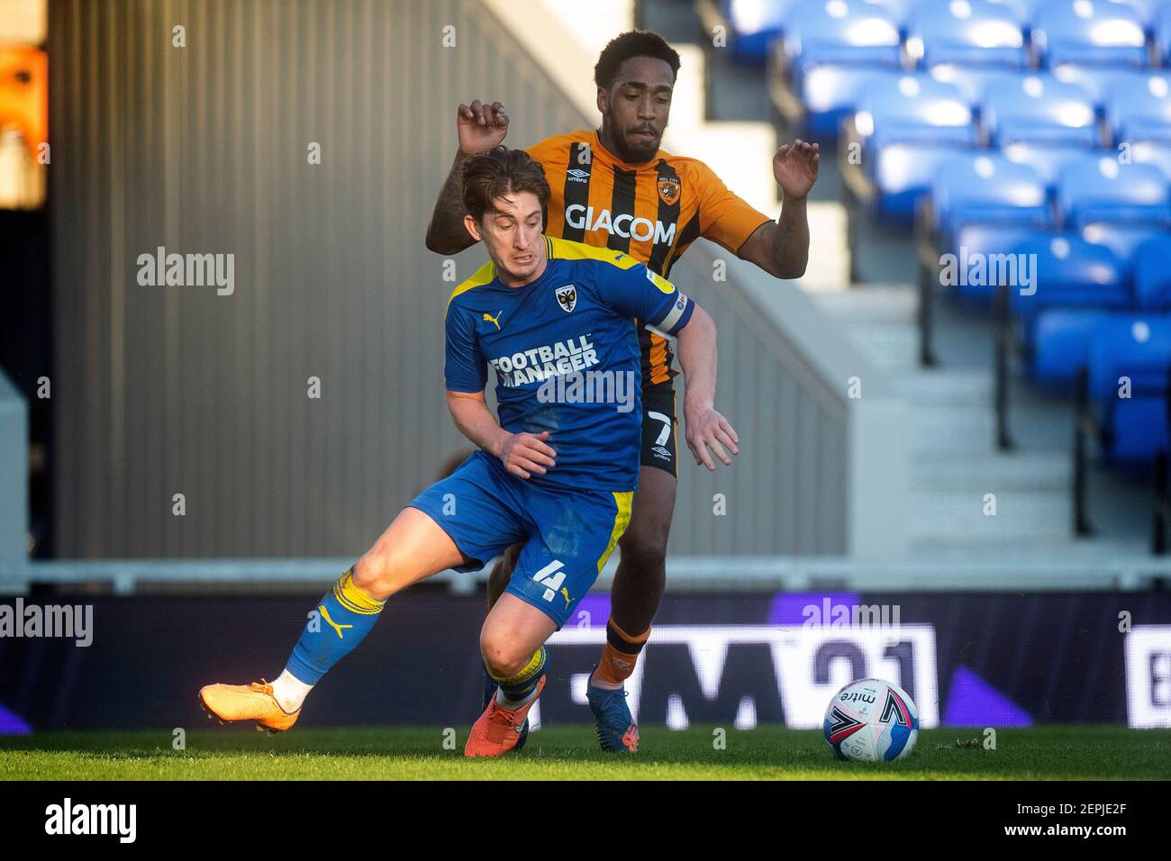 AFC Wimbledon's Alex Woodyard battles with Hull's Mallik Wilks during ...