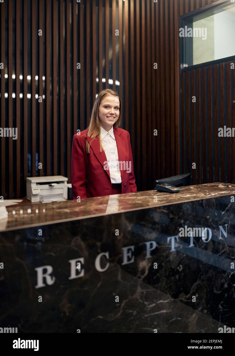 Female hotel receptionist hi-res stock photography and images - Alamy