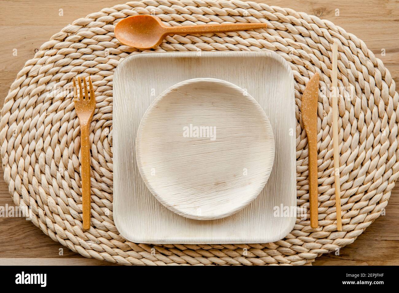 Set of dry biodegradable empty new palm leaf plates and edible fork ...