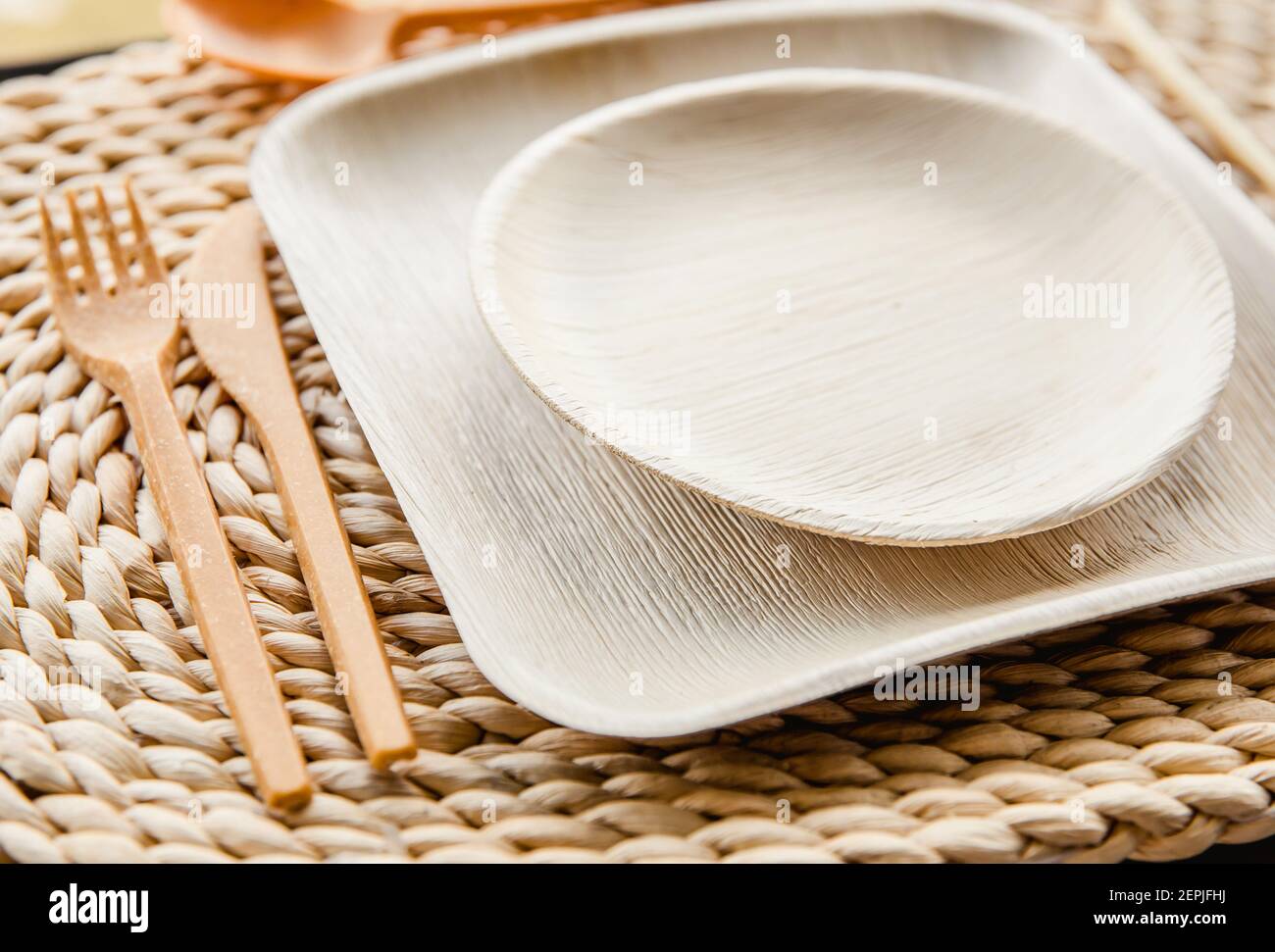 Set of dry biodegradable empty new palm leaf plates and edible fork ...