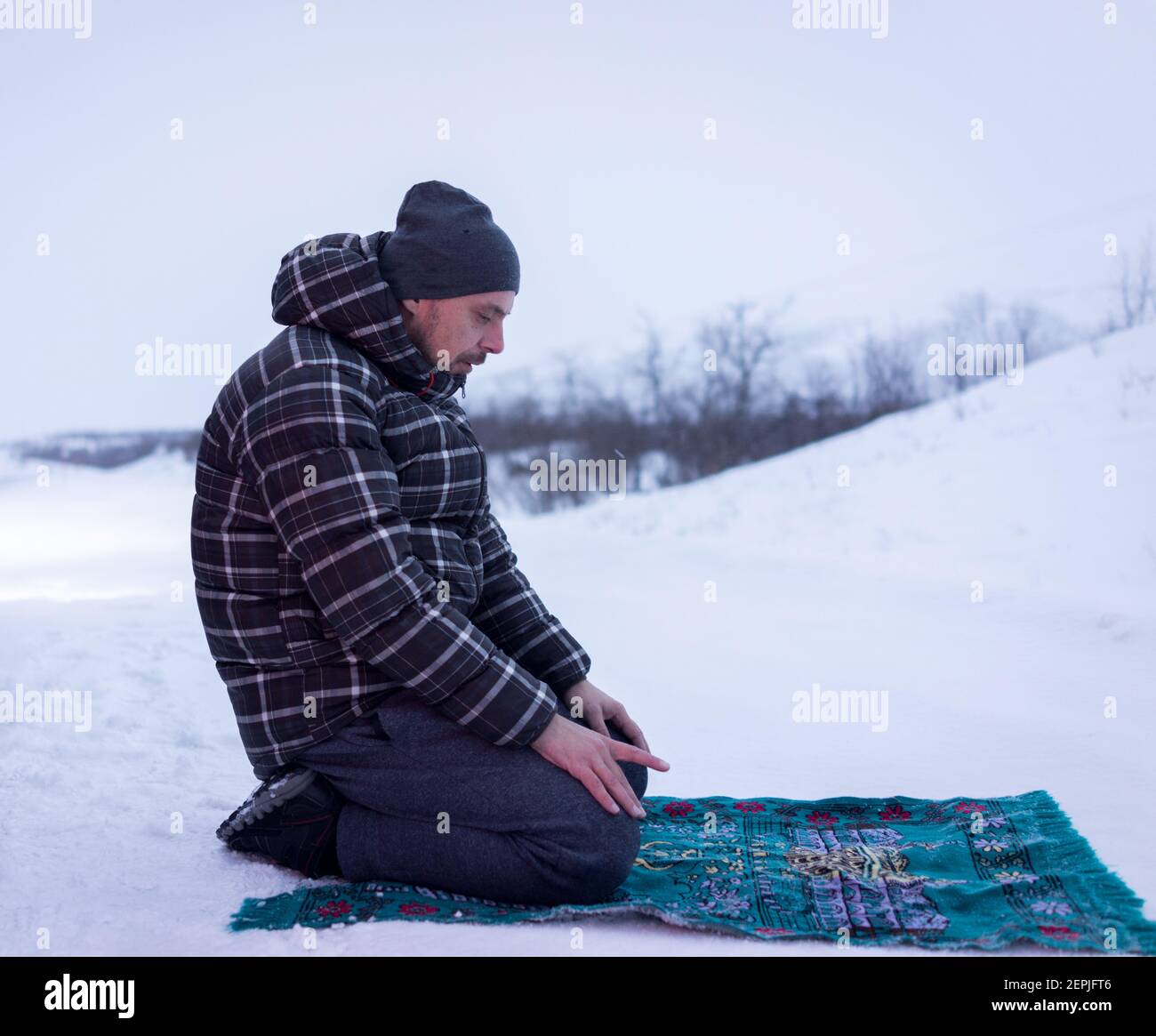 Muslim traveler praying in winter mountain , high quality Stock Photo ...
