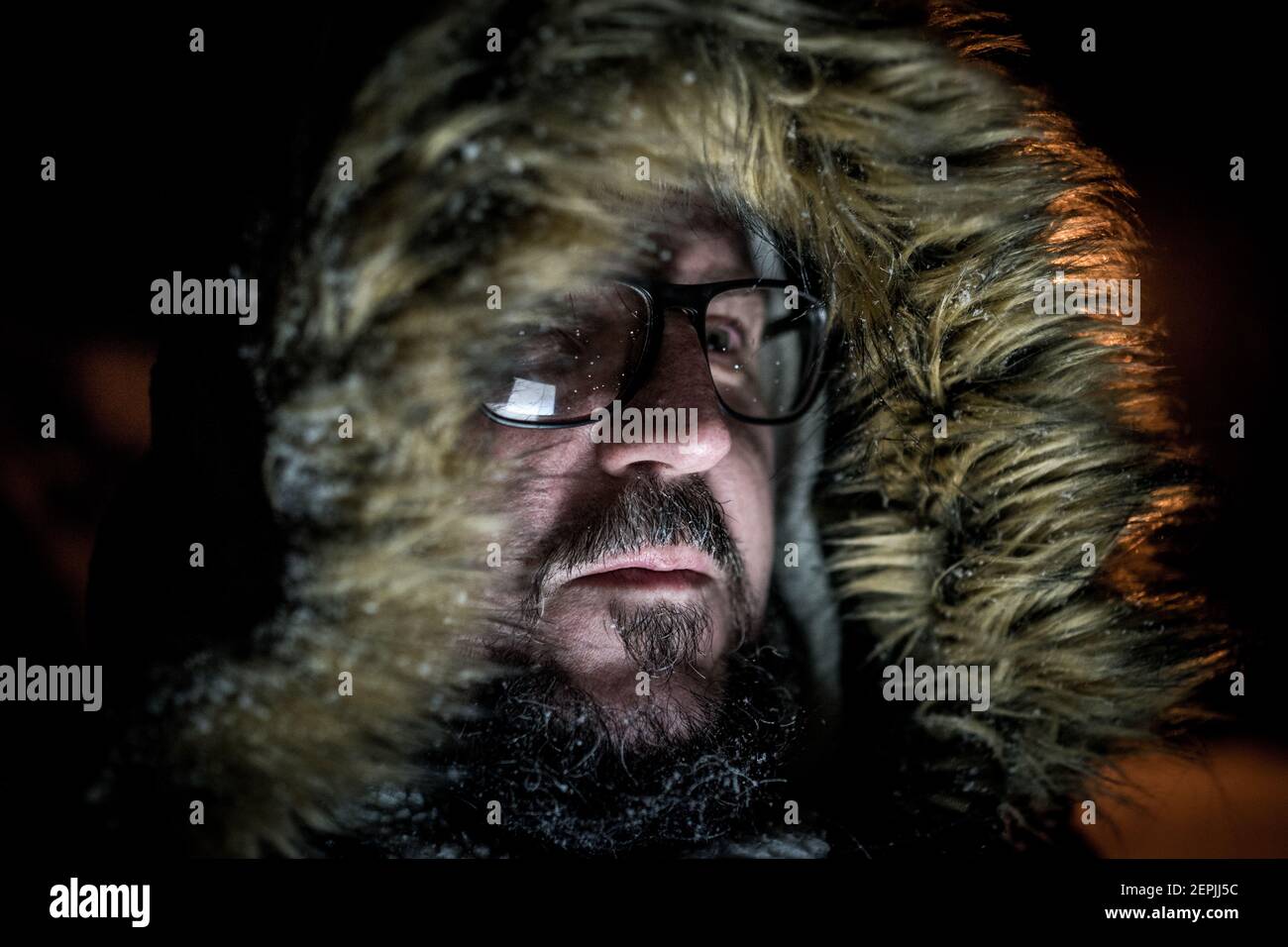 Winter man explorer with fur jacket portrait ready for adventure Stock ...