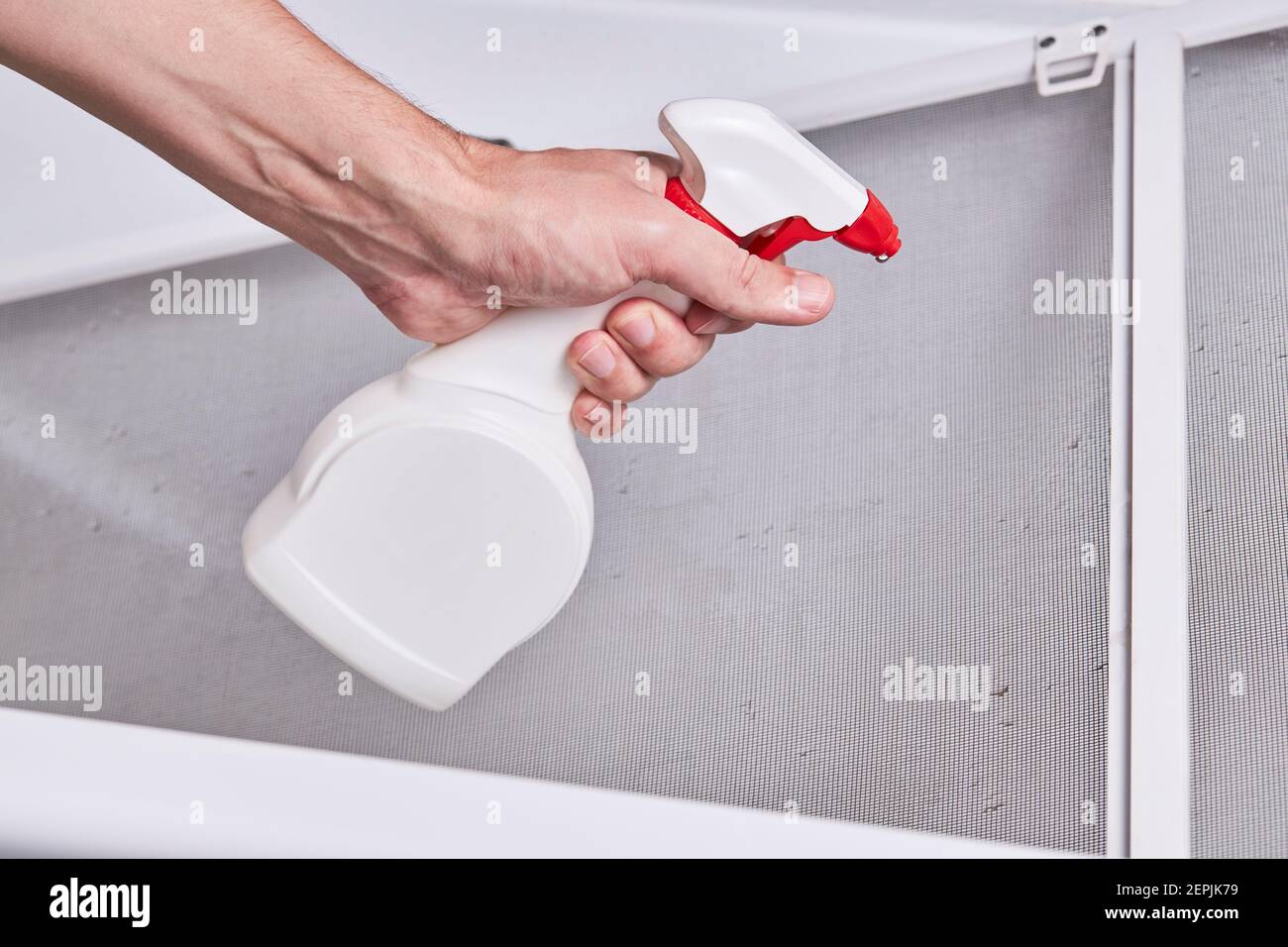 cleaning and washing dusty mosquito net screen for window. housework ...