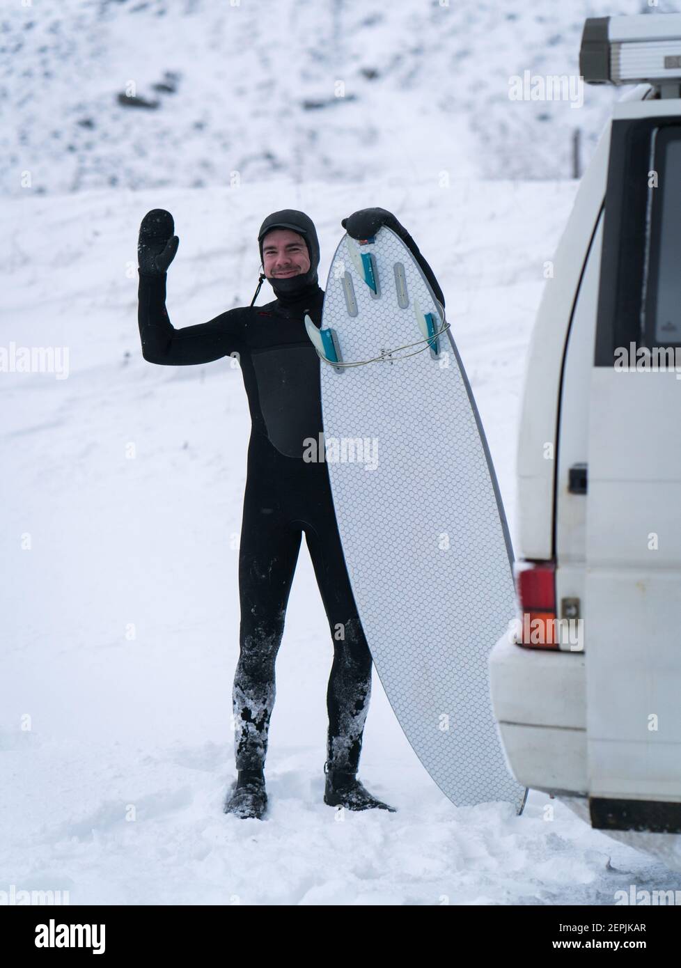 Winter surfer traveling with minivan Stock Photo - Alamy