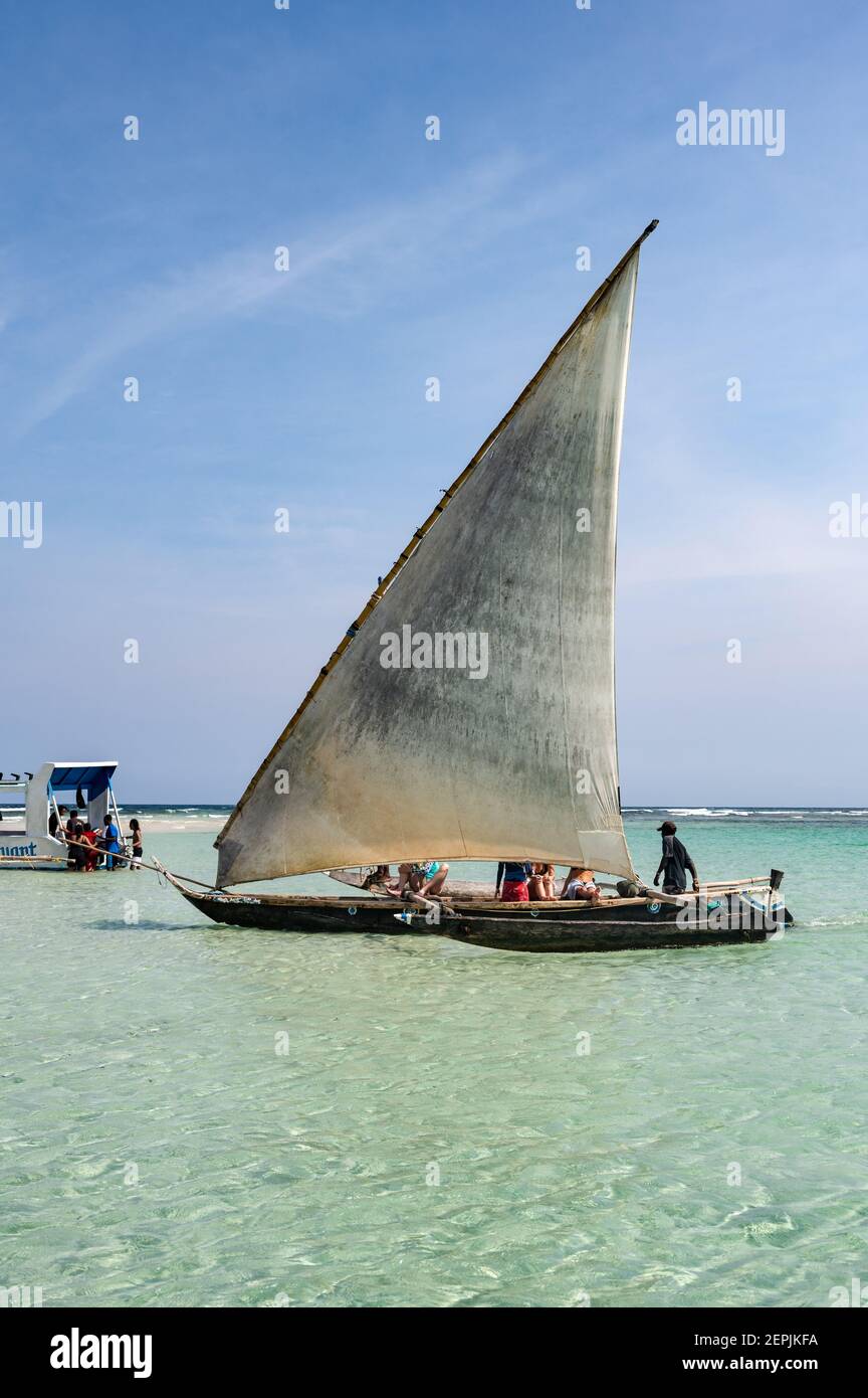 A traditional wooden fishing boat made from mango tree wood sailing ...