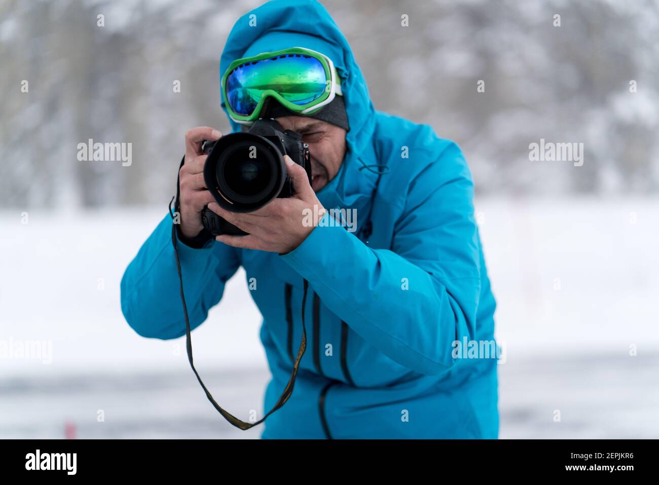 Professional photographer on task in winter wilderness Stock Photo - Alamy