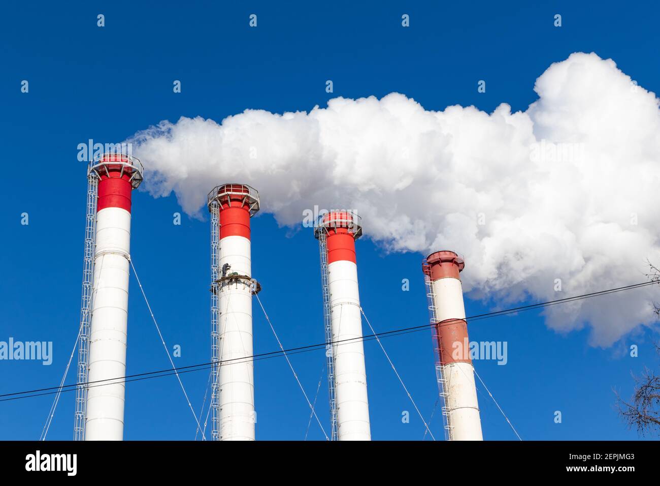red-white chimneys of the boiler room, equipped with a traffic light ...