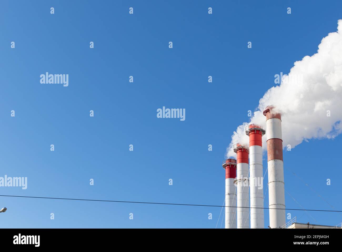 red-white chimneys of the boiler room, equipped with a traffic light ...