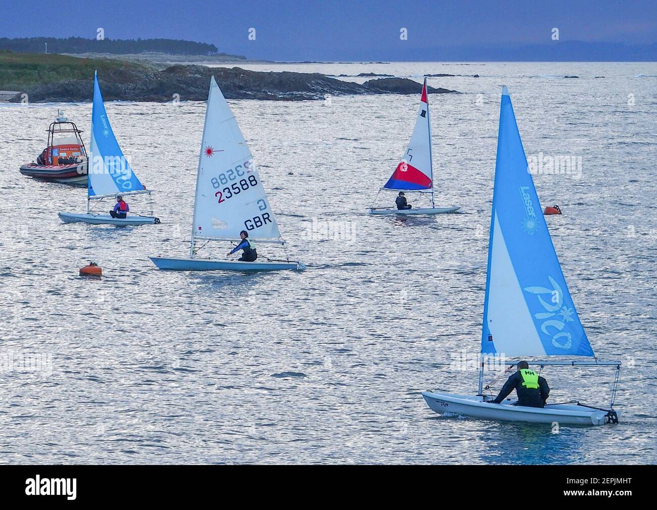 Laser, Topper and Pico sailing dinghies, sailing in West Bay, North ...