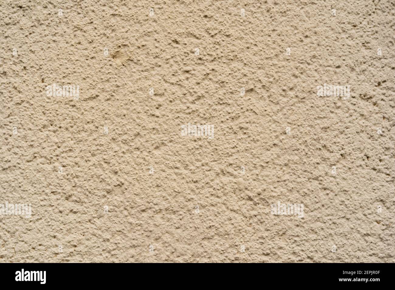 Yellow beige wall plaster structure pattern on a stucco wall texture ...