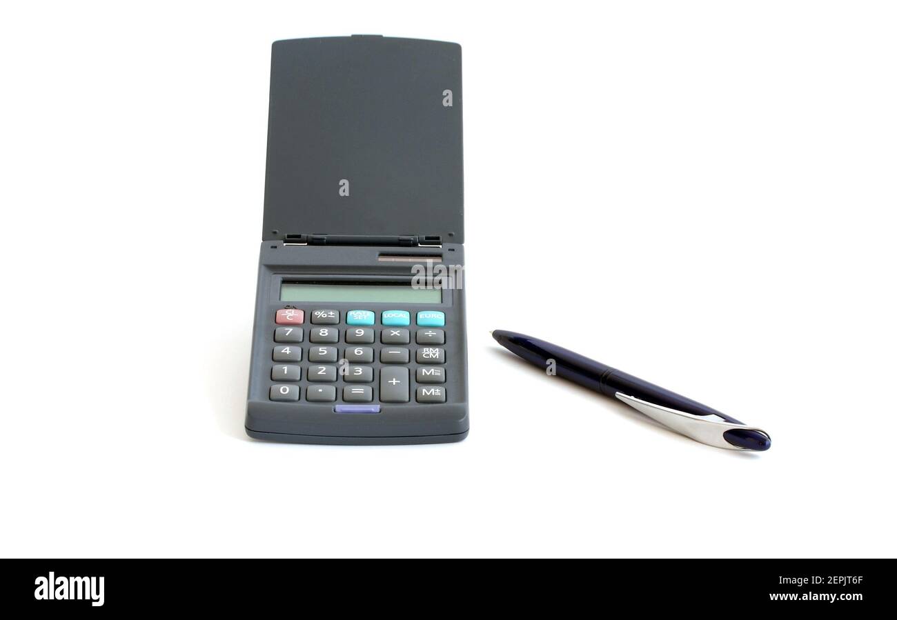 Calculator with a ballpoint pen on a white background Stock Photo - Alamy