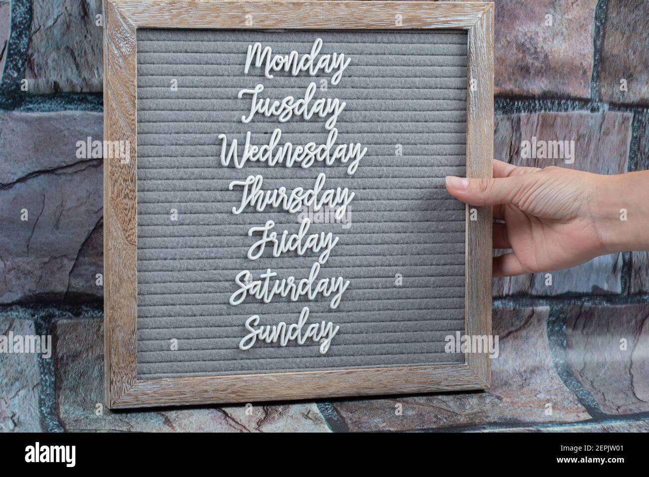 Happy weekdays posters embedded on grey background Stock Photo - Alamy