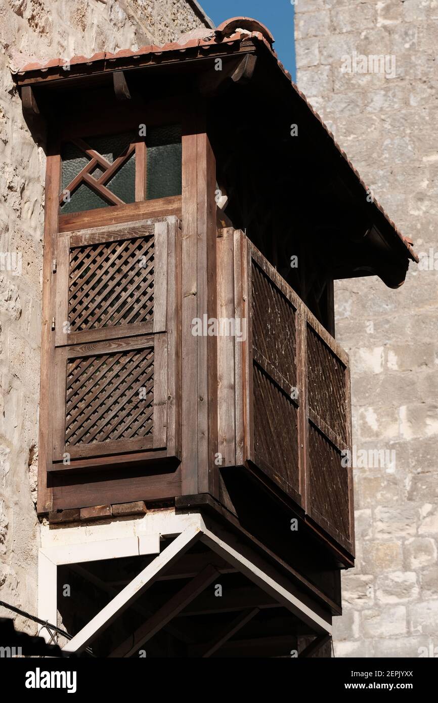 Mashrabiya oriel window enclosed with wooden lattice work supported by ...