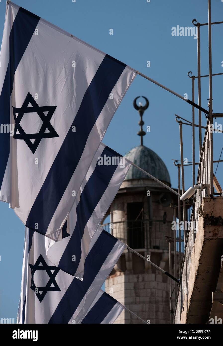Israeli flags hanging from a house Jewish settlers took over in Al Wad ...