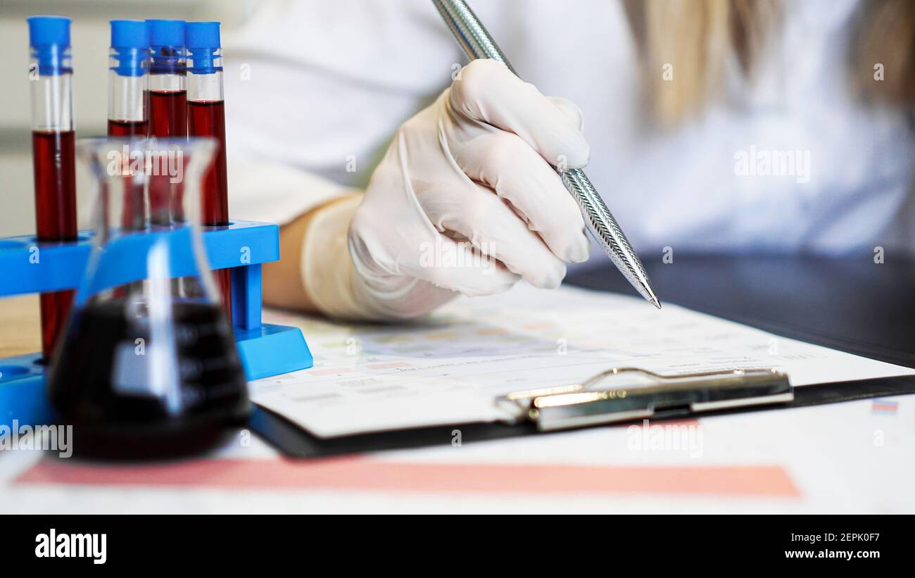 Blood test red tube report hi-res stock photography and images - Alamy