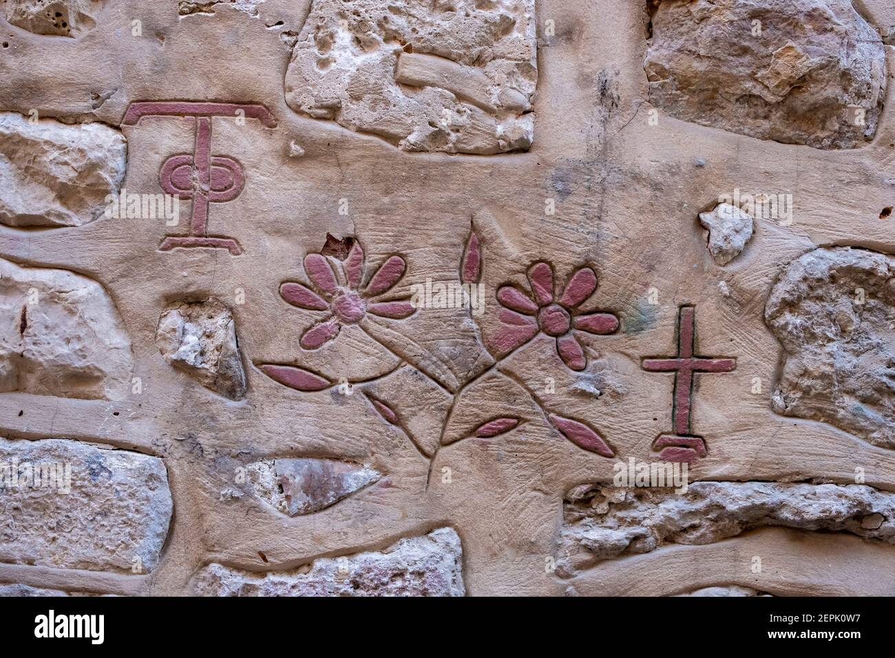 Greek Orthodox symbols carved in a wall in the Christian Quarter old ...