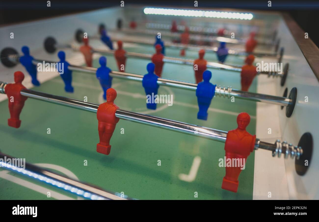 Table football game with red and blue players Stock Photo - Alamy