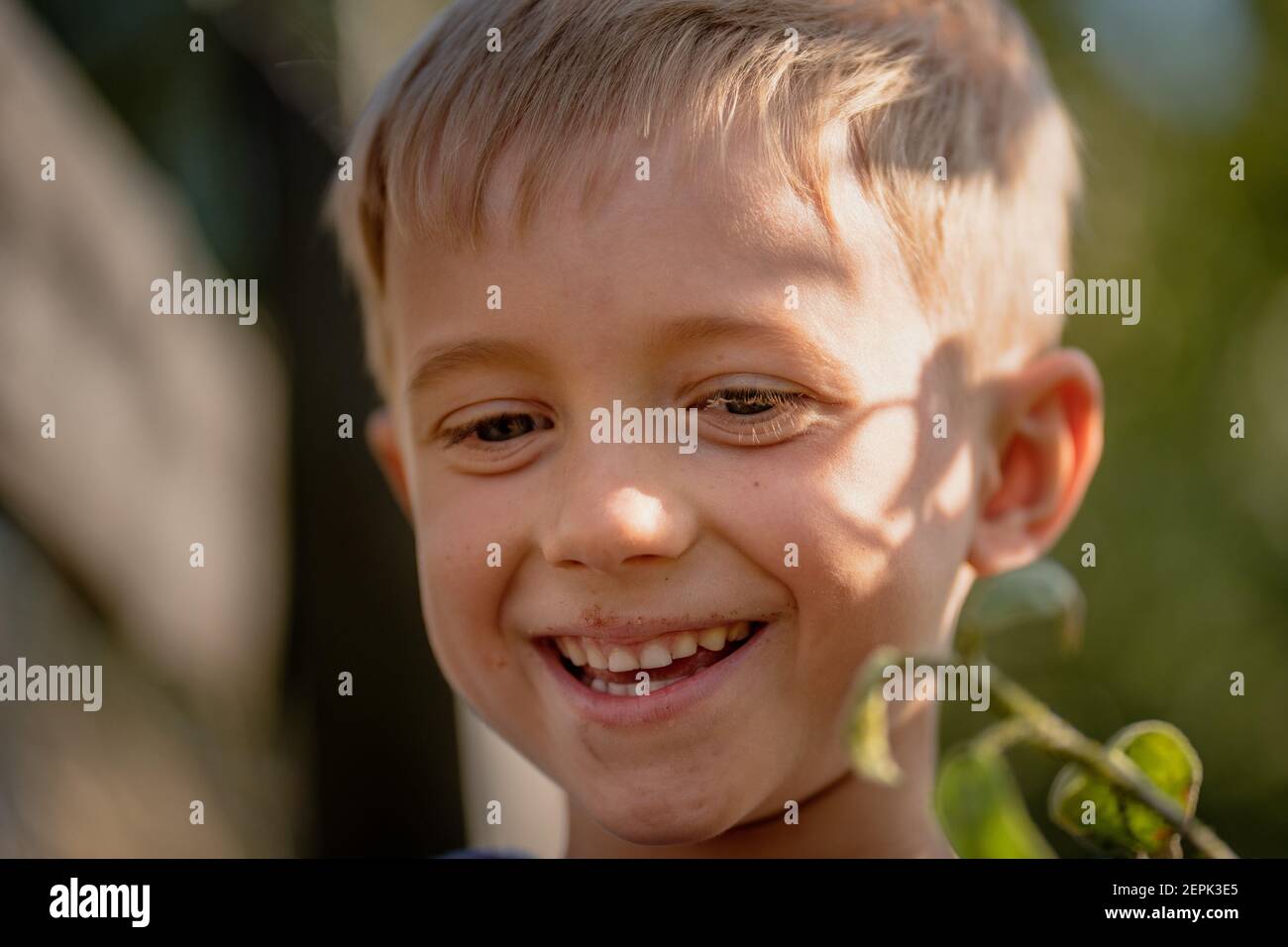 Natural portrait of smiling boy Stock Photo - Alamy