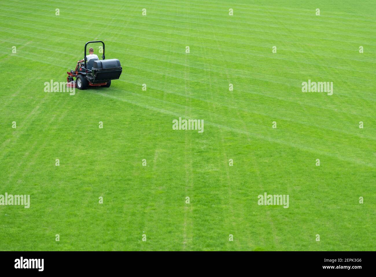 Mowing grass at the football stadium Stock Photo - Alamy
