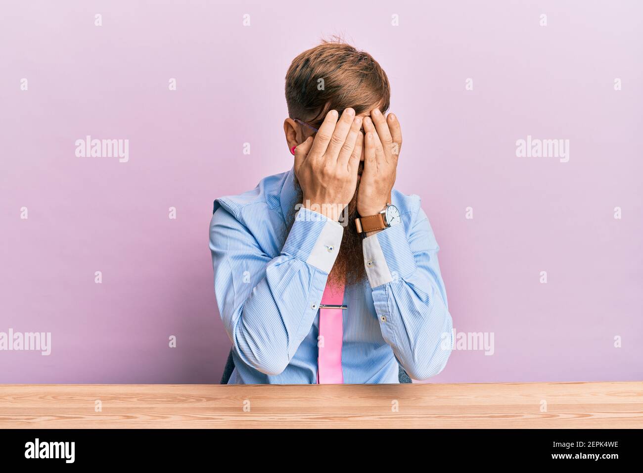 Young irish redhead man wearing business shirt and tie sitting on the ...