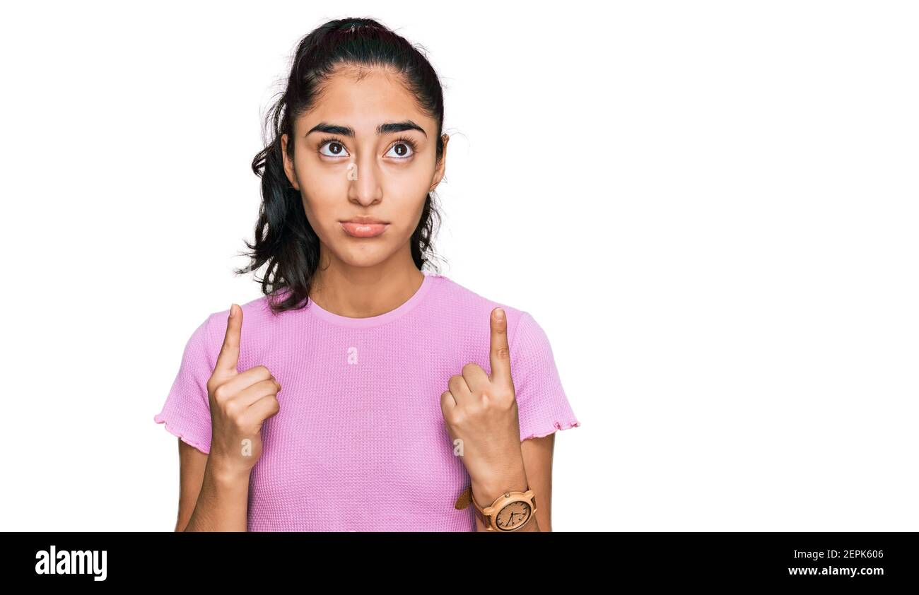 Hispanic teenager girl with dental braces wearing casual clothes ...