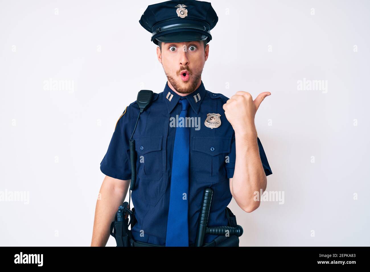 Man police officer pointing thumb hi-res stock photography and images ...