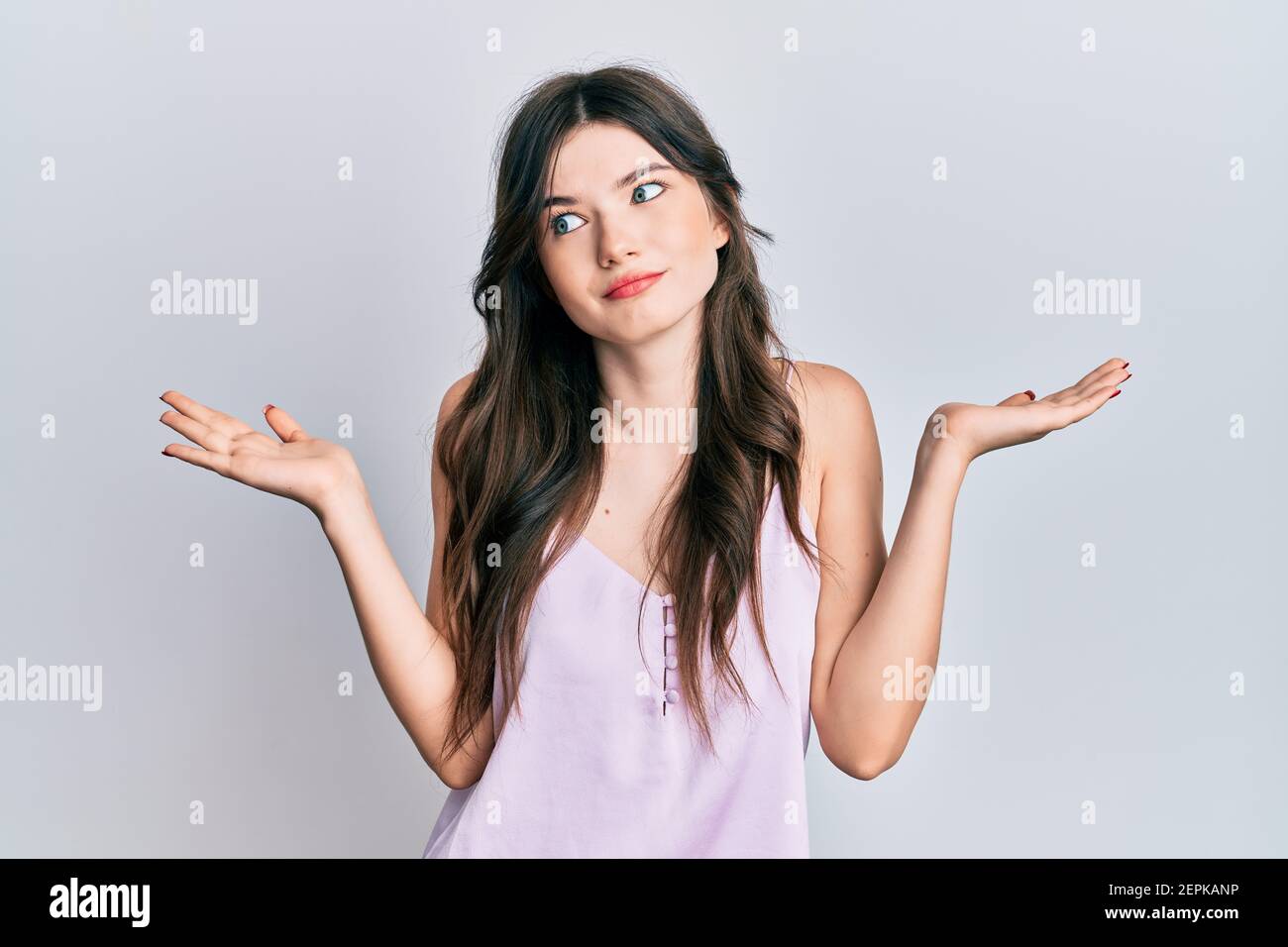 Young beautiful caucasian girl wearing casual clothes clueless and ...