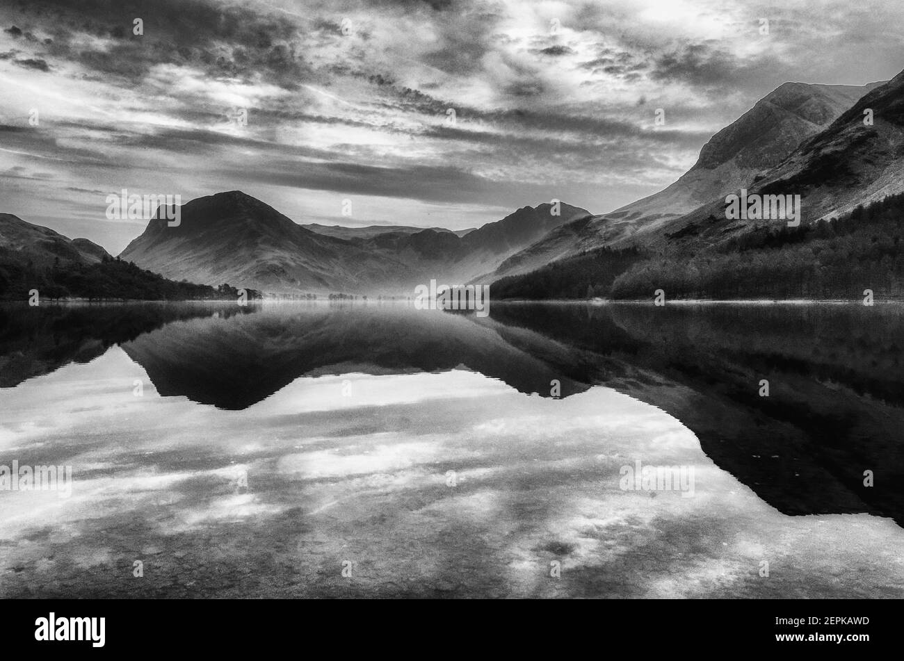 The Cumbrian mountains mirrored in Buttermere in The Lake District ...