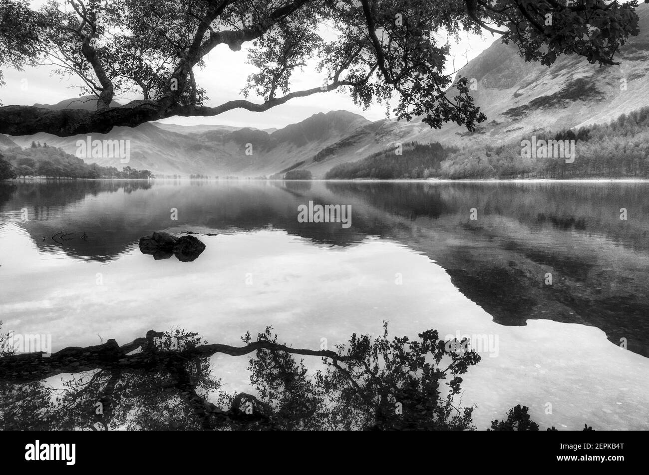 The Cumbrian mountains mirrored in Buttermere in The Lake District ...
