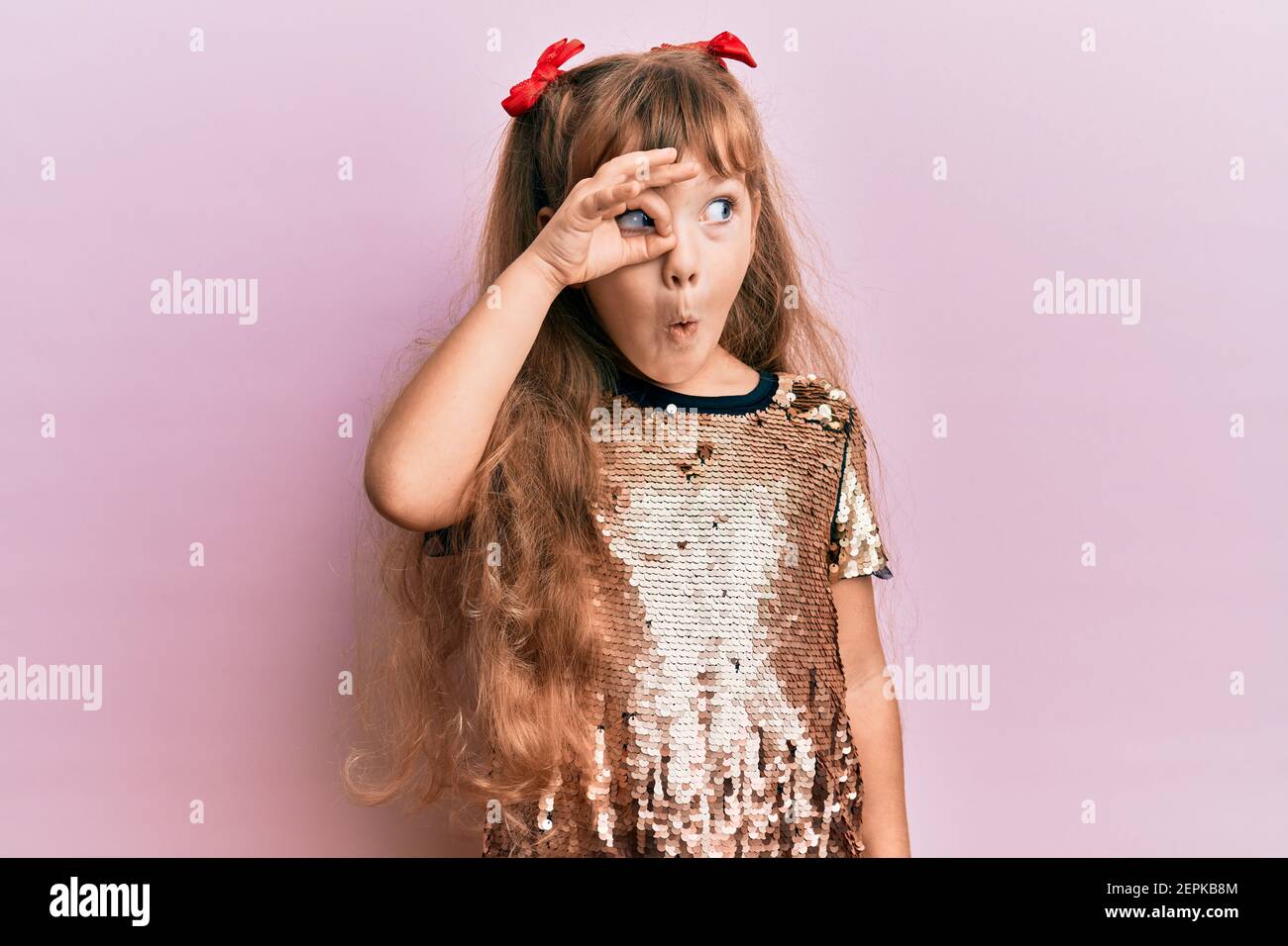 Little caucasian girl kid wearing festive sequins dress doing ok ...