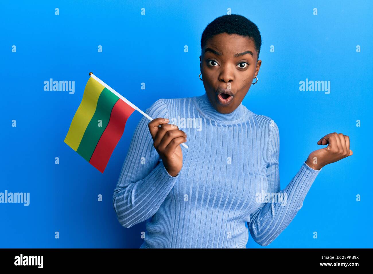 Woman holding lithuanian flag hi-res stock photography and images - Alamy
