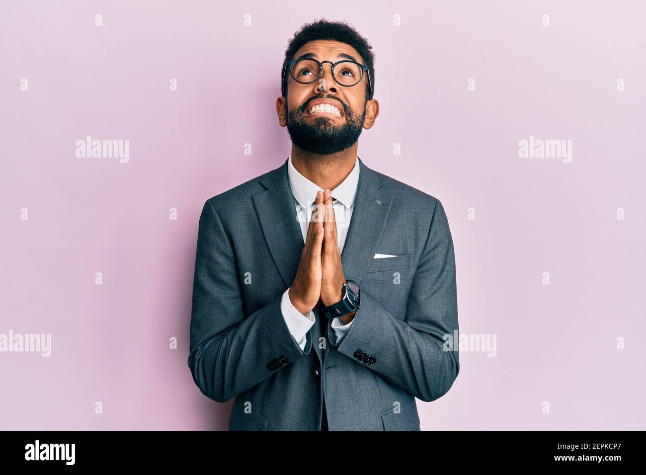 Handsome hispanic business man with beard wearing business suit and tie ...