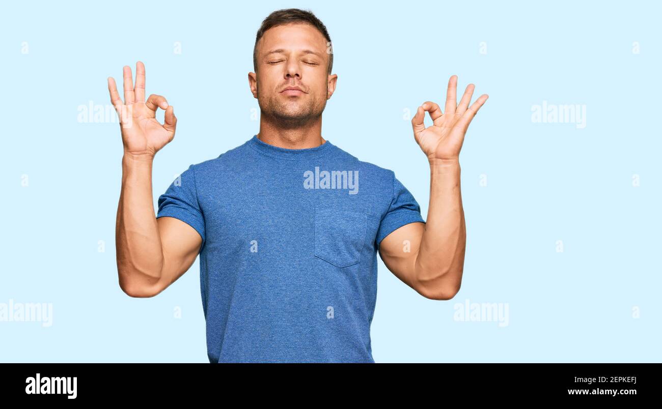 Handsome muscle man wearing casual clothes relax and smiling with eyes ...