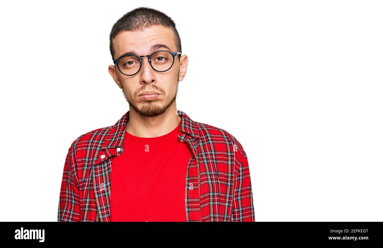 Hispanic young man wearing casual clothes depressed and worry for ...