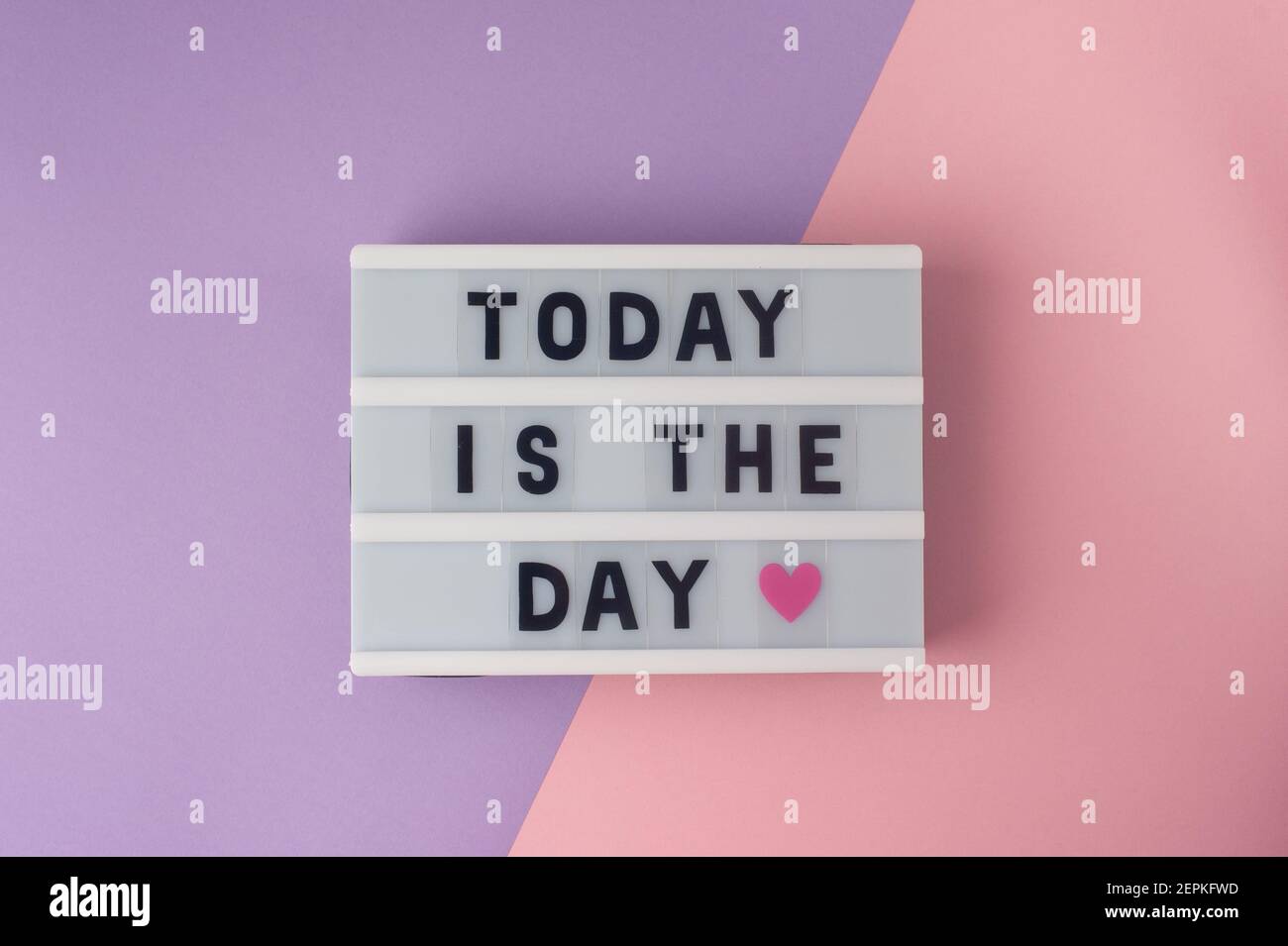 Today is the day - text on display lightbox on purple and pink ...